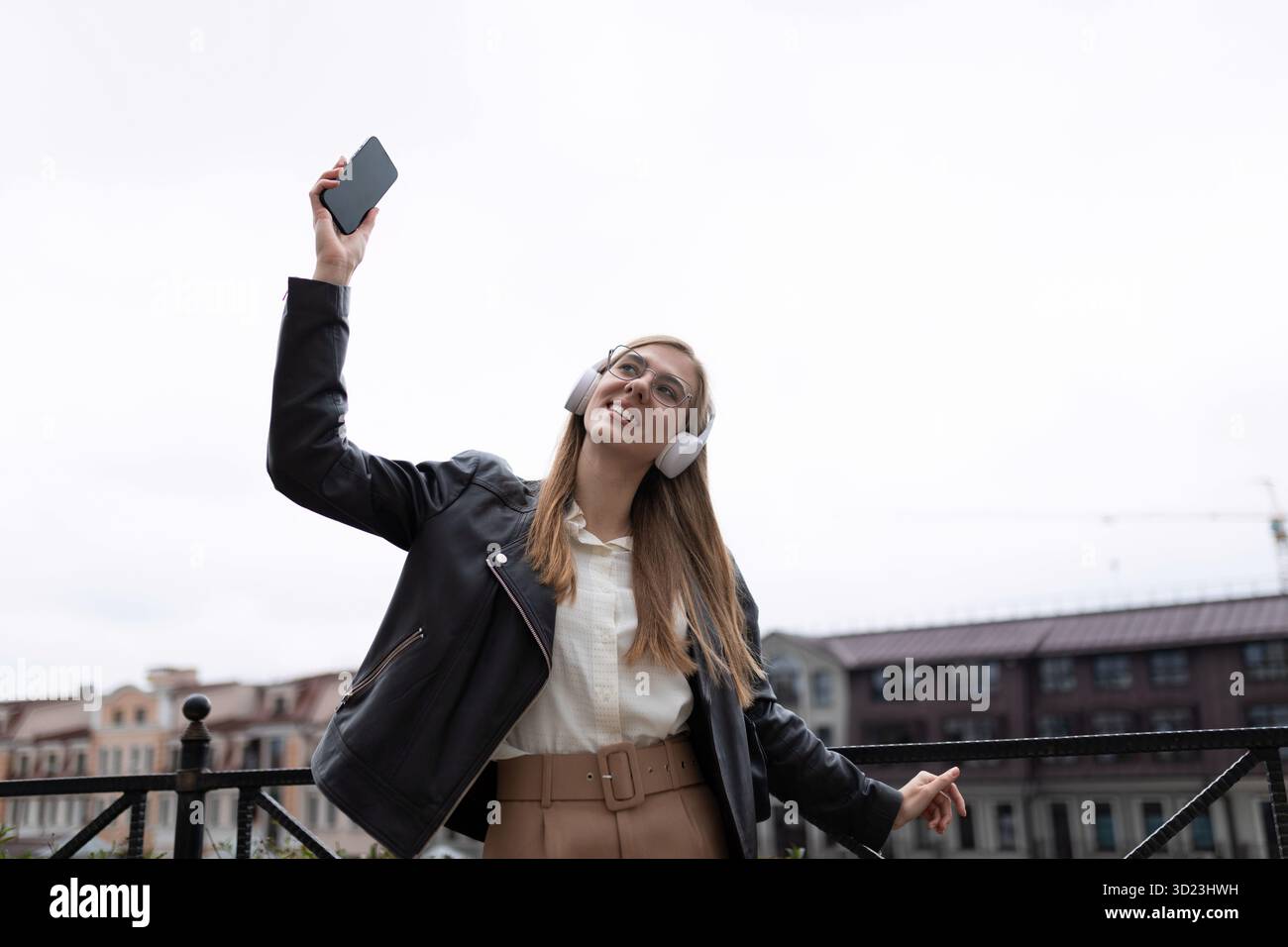 Woman headphones in hands hi-res stock photography and images - Alamy