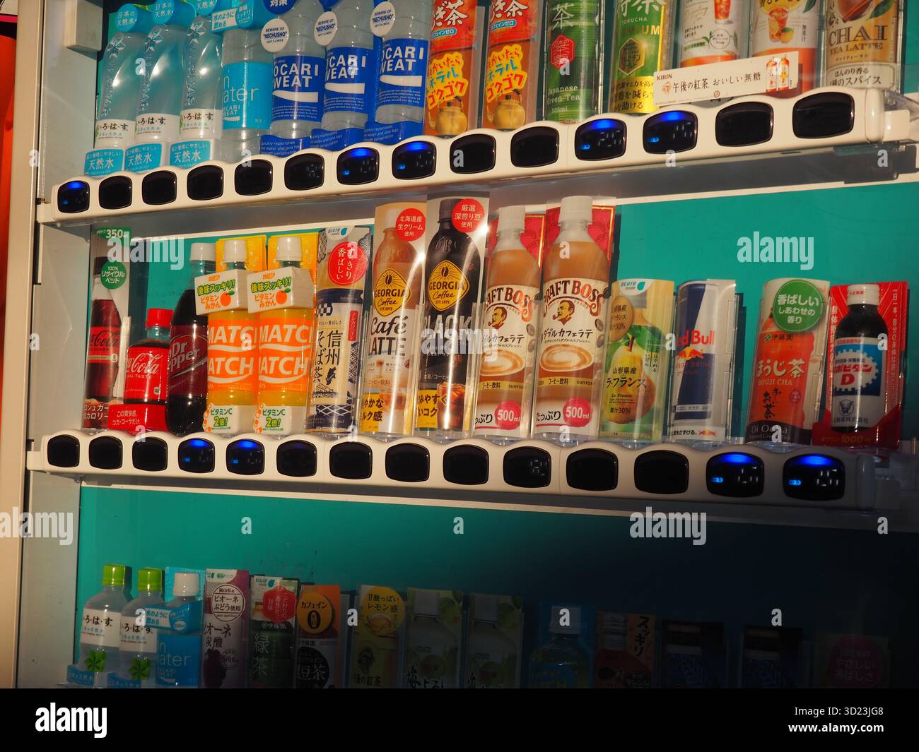 Colorful Japanese vending machine filled with drinks and soft beverages ...