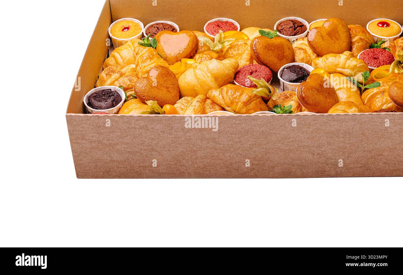 Assorted pastries displayed in a box for a dessert event Stock Photo ...