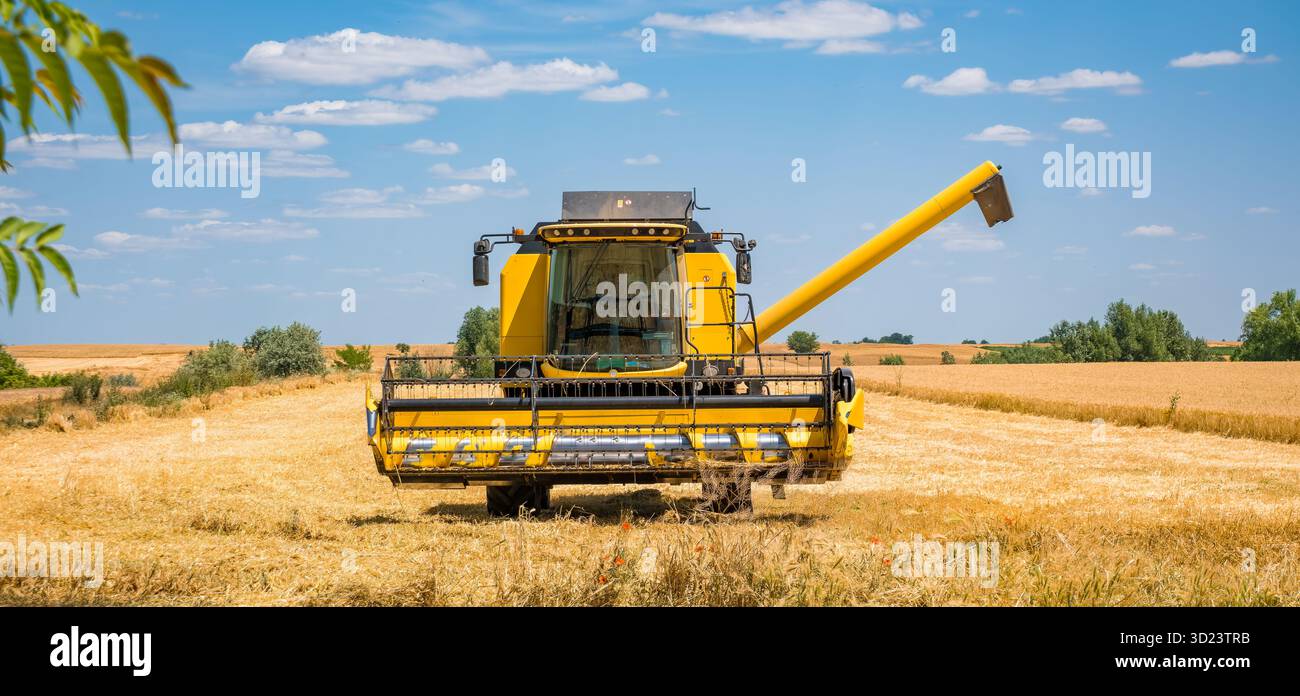 Yellow combine harvester stands hi-res stock photography and images - Alamy