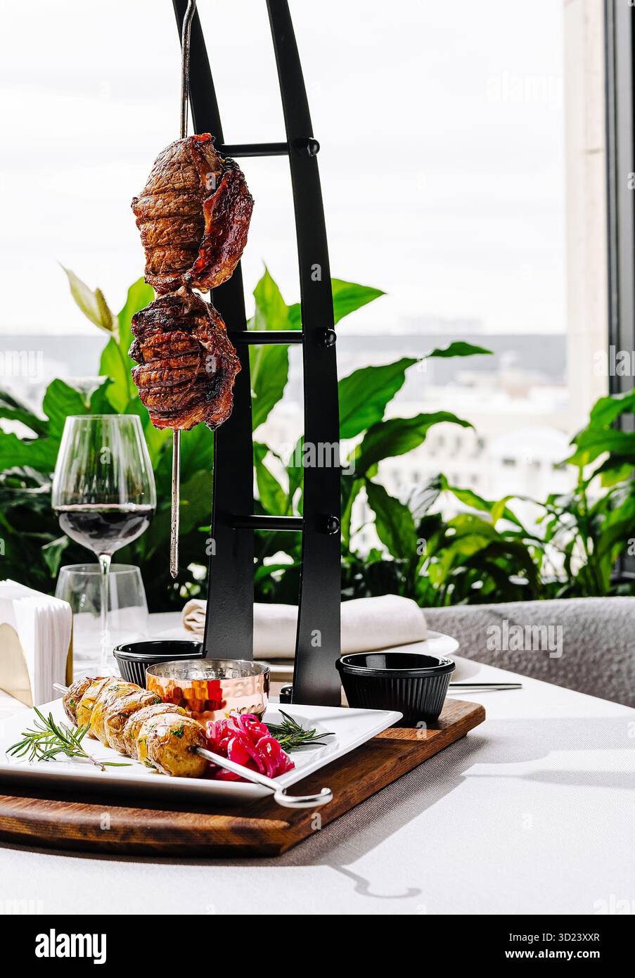 Gourmet dining experience with grilled meat and wine indoors Stock ...