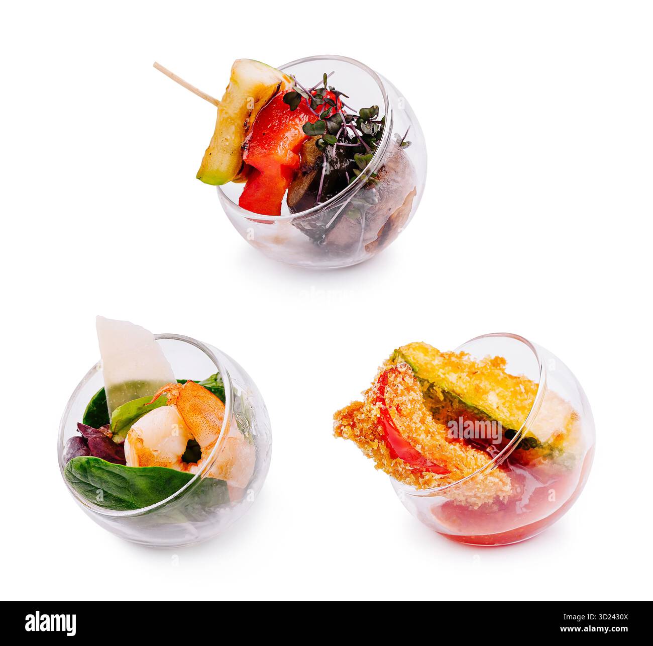 Colorful appetizers served in glass bowls at a modern culinary event ...