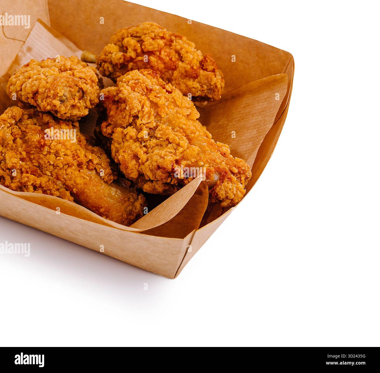 Crispy fried chicken served in a takeout container with a golden brown ...