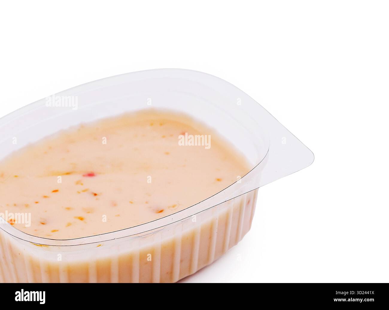 Creamy dip served in a plastic container with a rustic design Stock ...