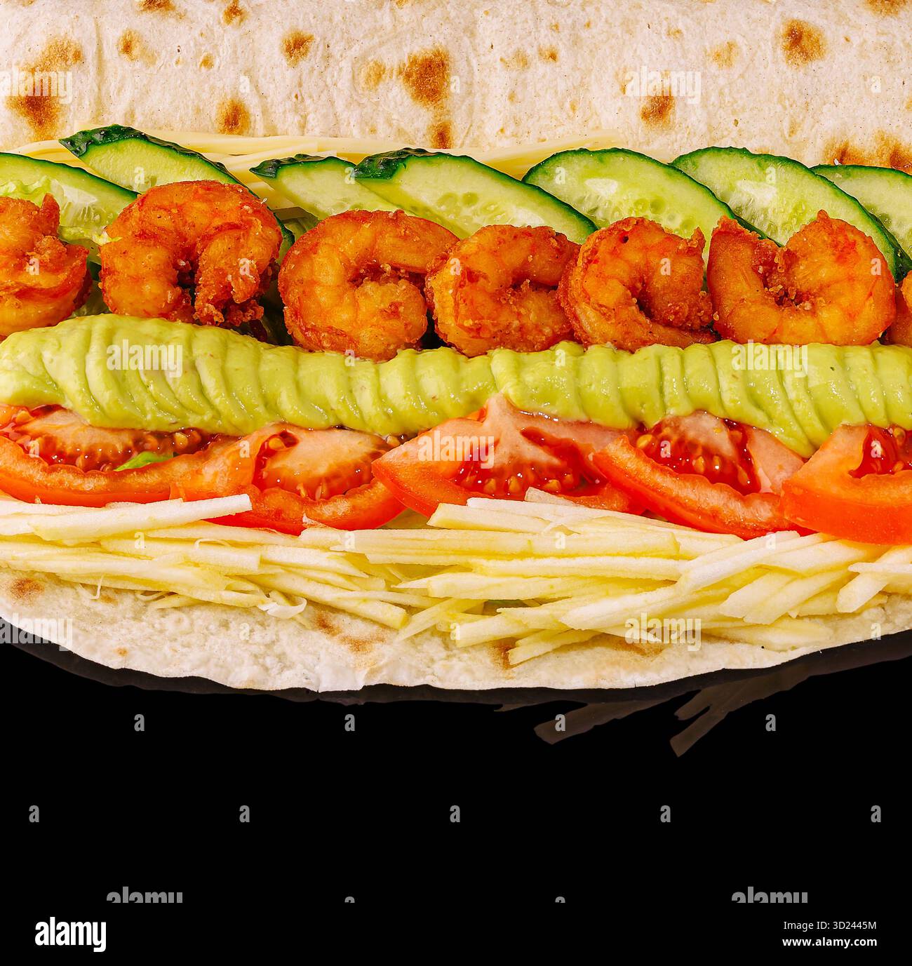 Savory shrimp wrap with fresh veggies and toppings at a food stall ...