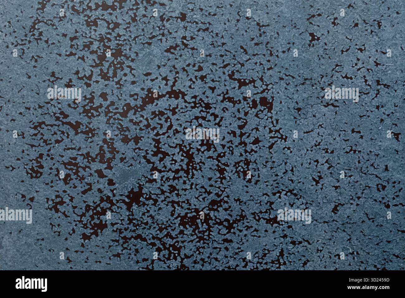 Unique texture of rough blue surface with scattered patterns resembling ...