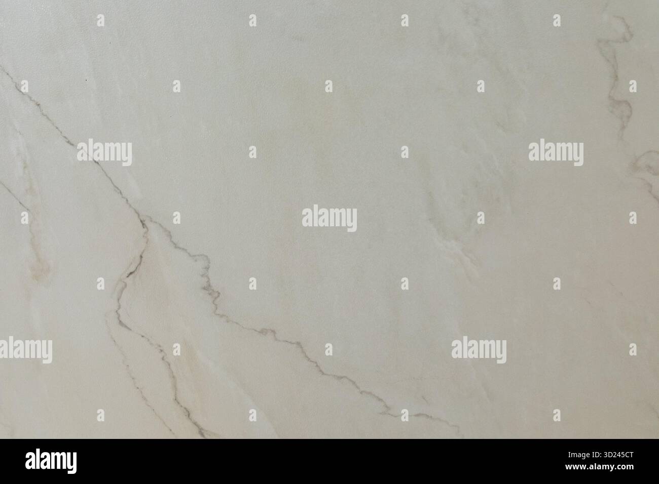 Smooth, light marble surface showing subtle veins and textures ...