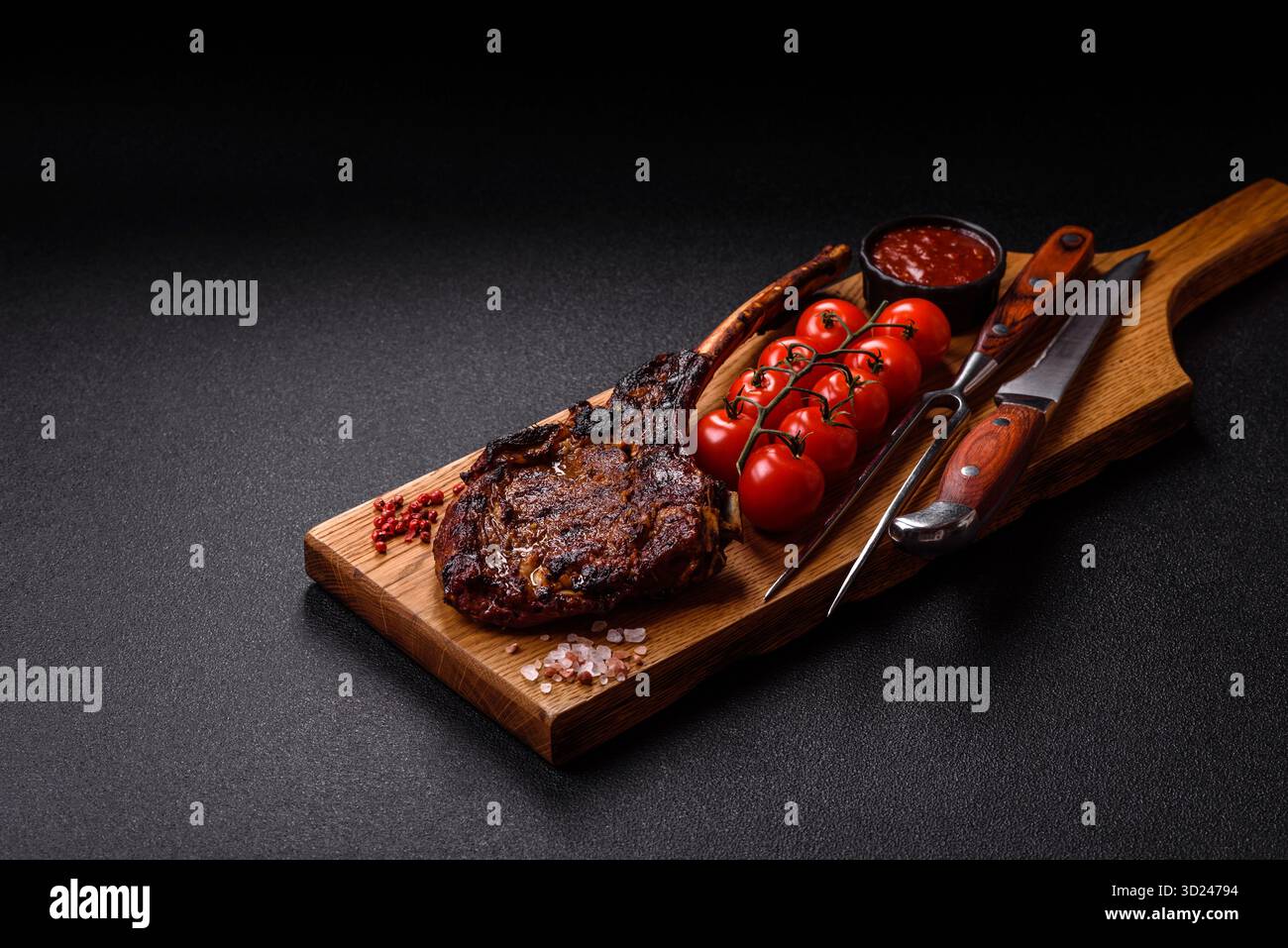 Grilled bone-in meat, beef tomahawk steak, juicy barbecued meat ...