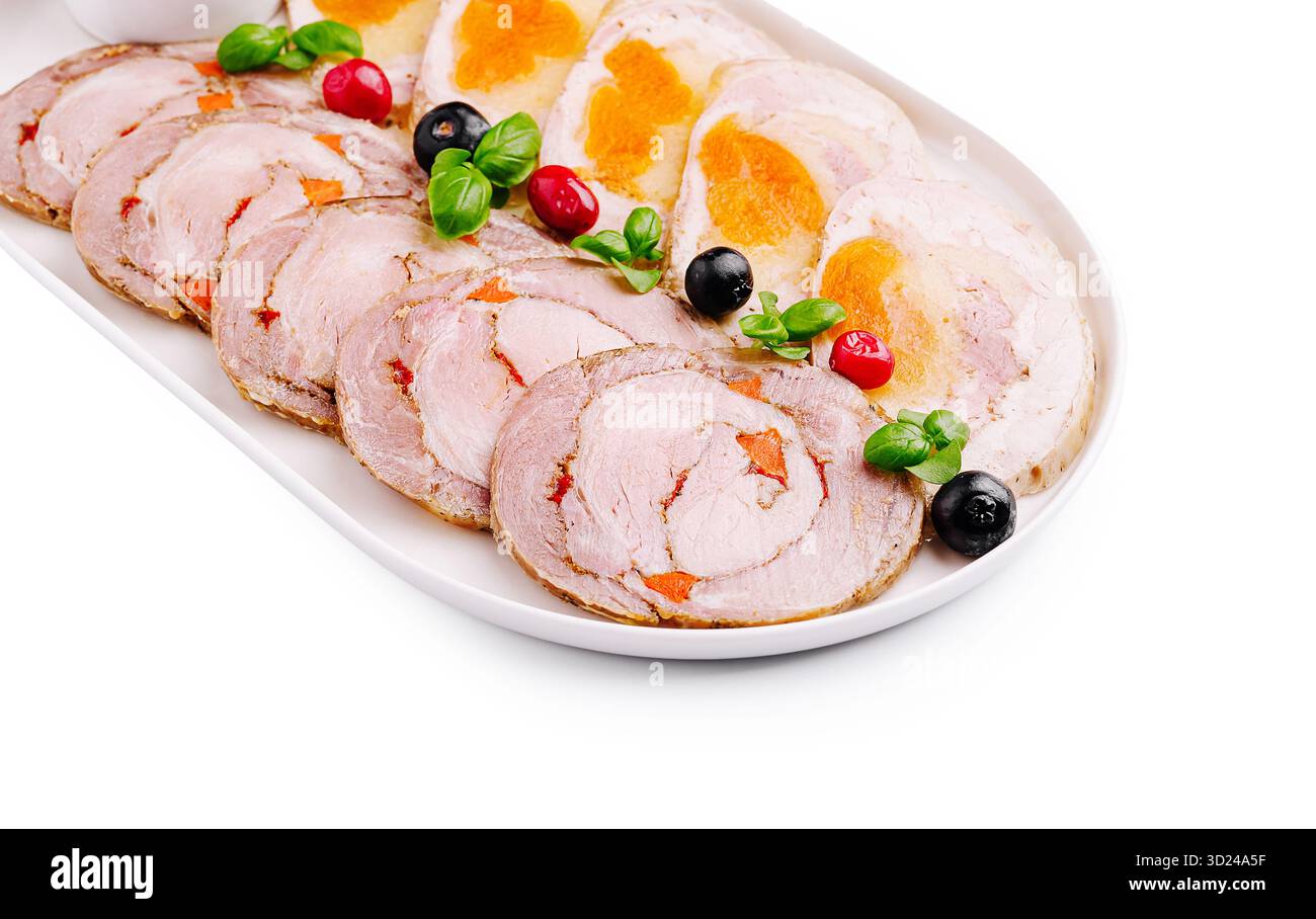 Culinary platter featuring savory rolled meats with colorful garnishes ...