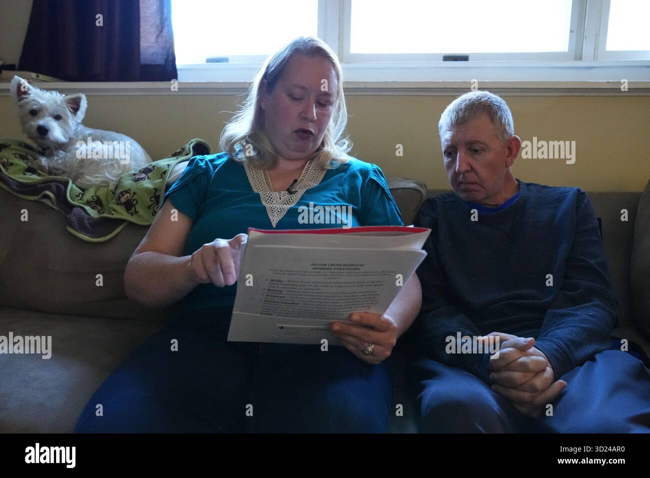 Bill Swick, right, studies with his wife Martha Swick at their home in ...