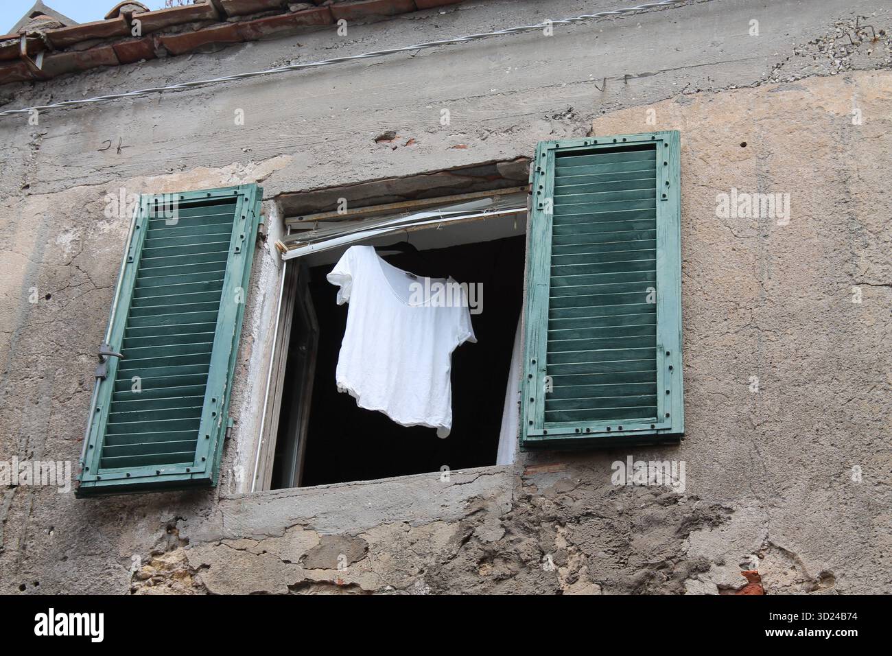 T-shirt on a window Stock Photo - Alamy