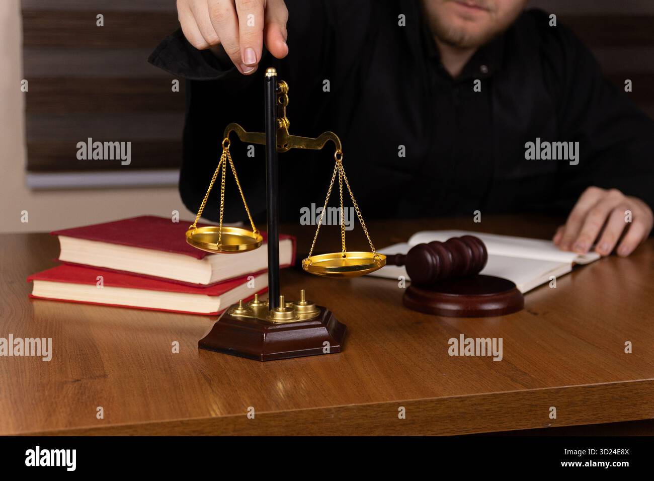 A judge is shown holding the scales of justice Stock Photo - Alamy