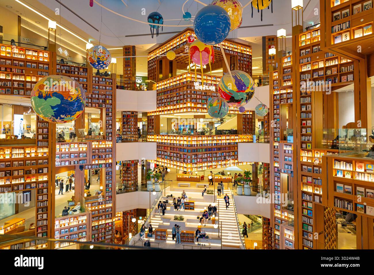 ditorial photo showing crowds sitting on central reading steps inside ...