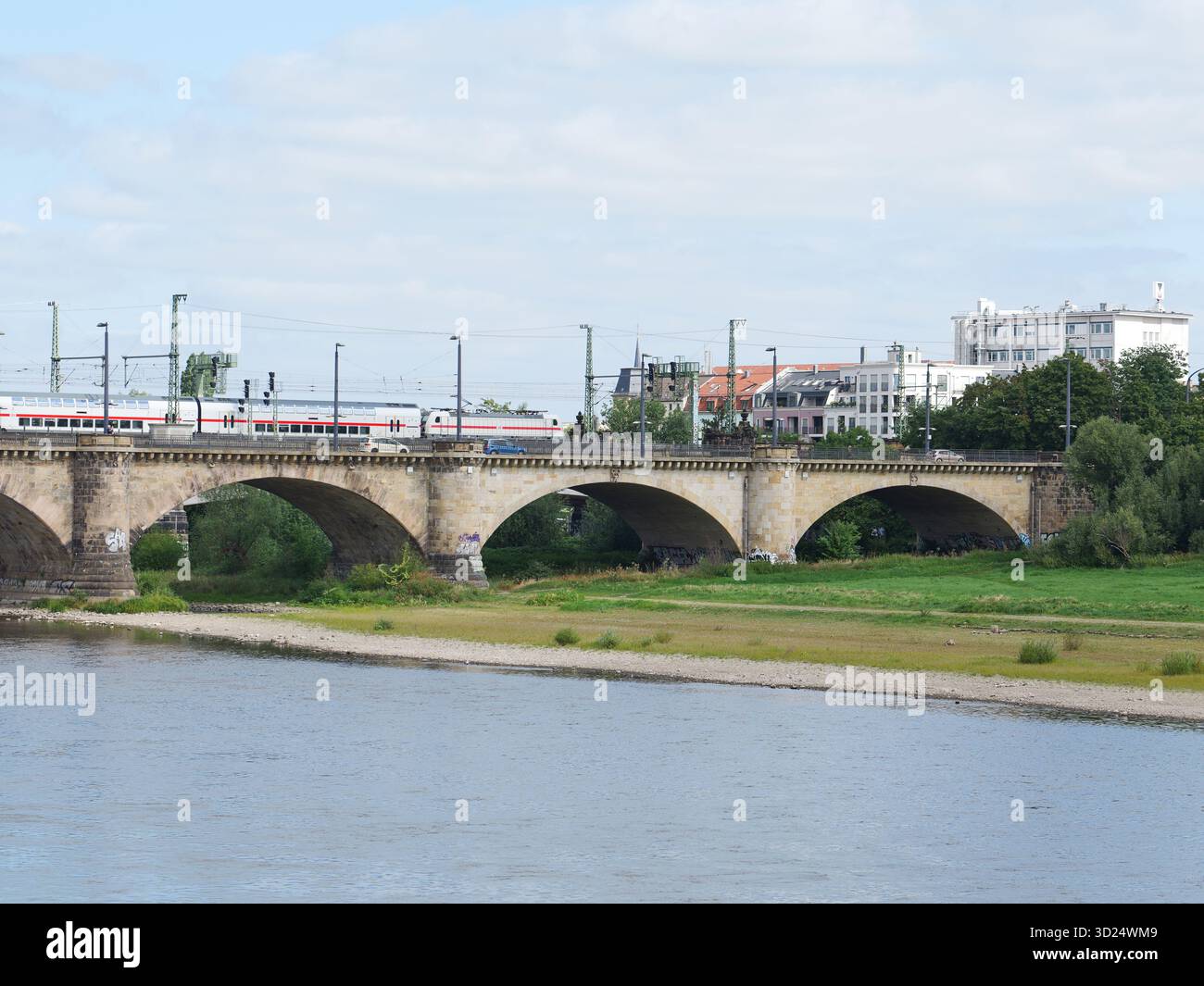 The Marien Bridge in Dresden with train over the Elbe, historic stone ...