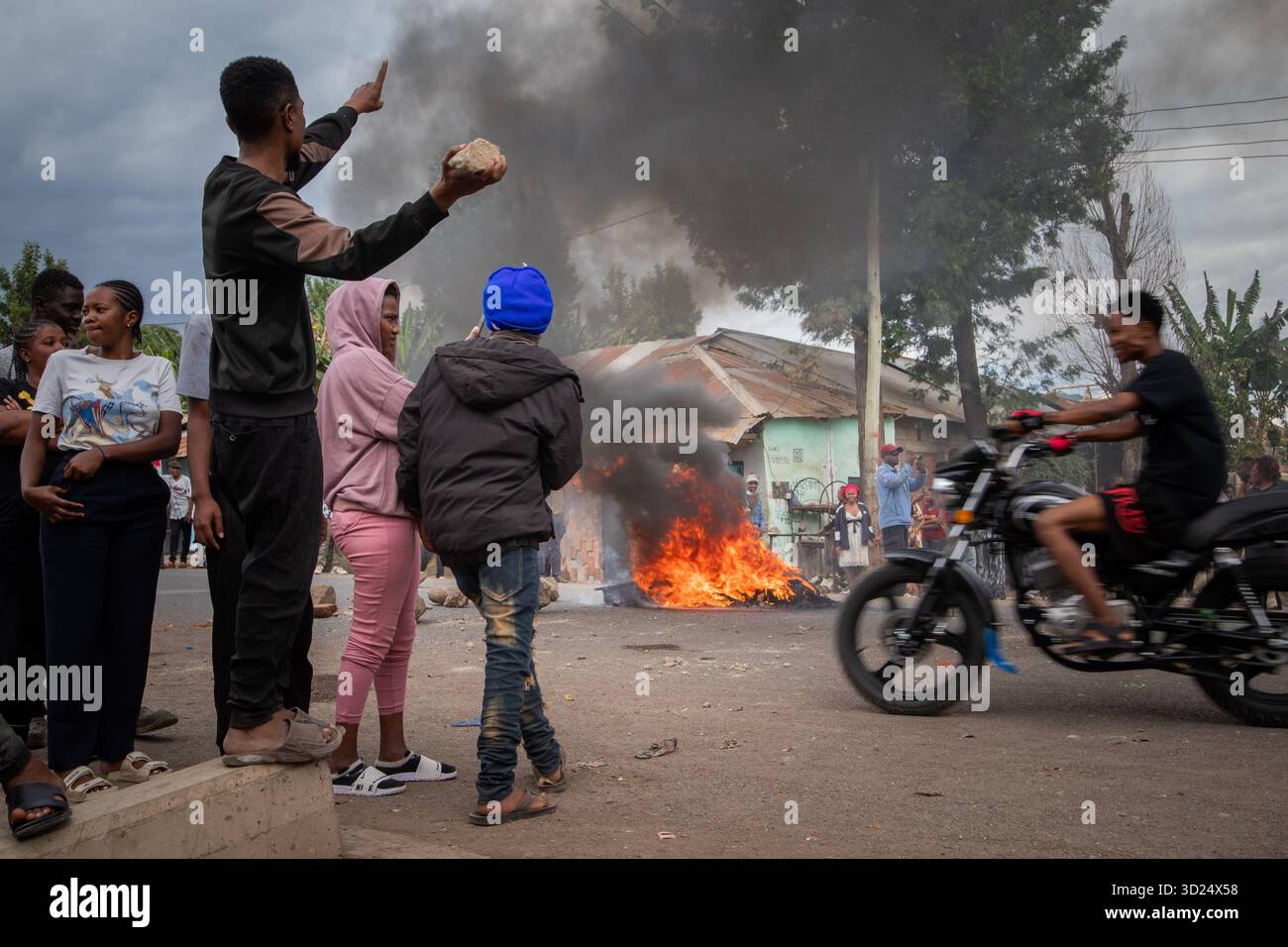 People protest in the streets of Arusha, Tanzania, on election day ...