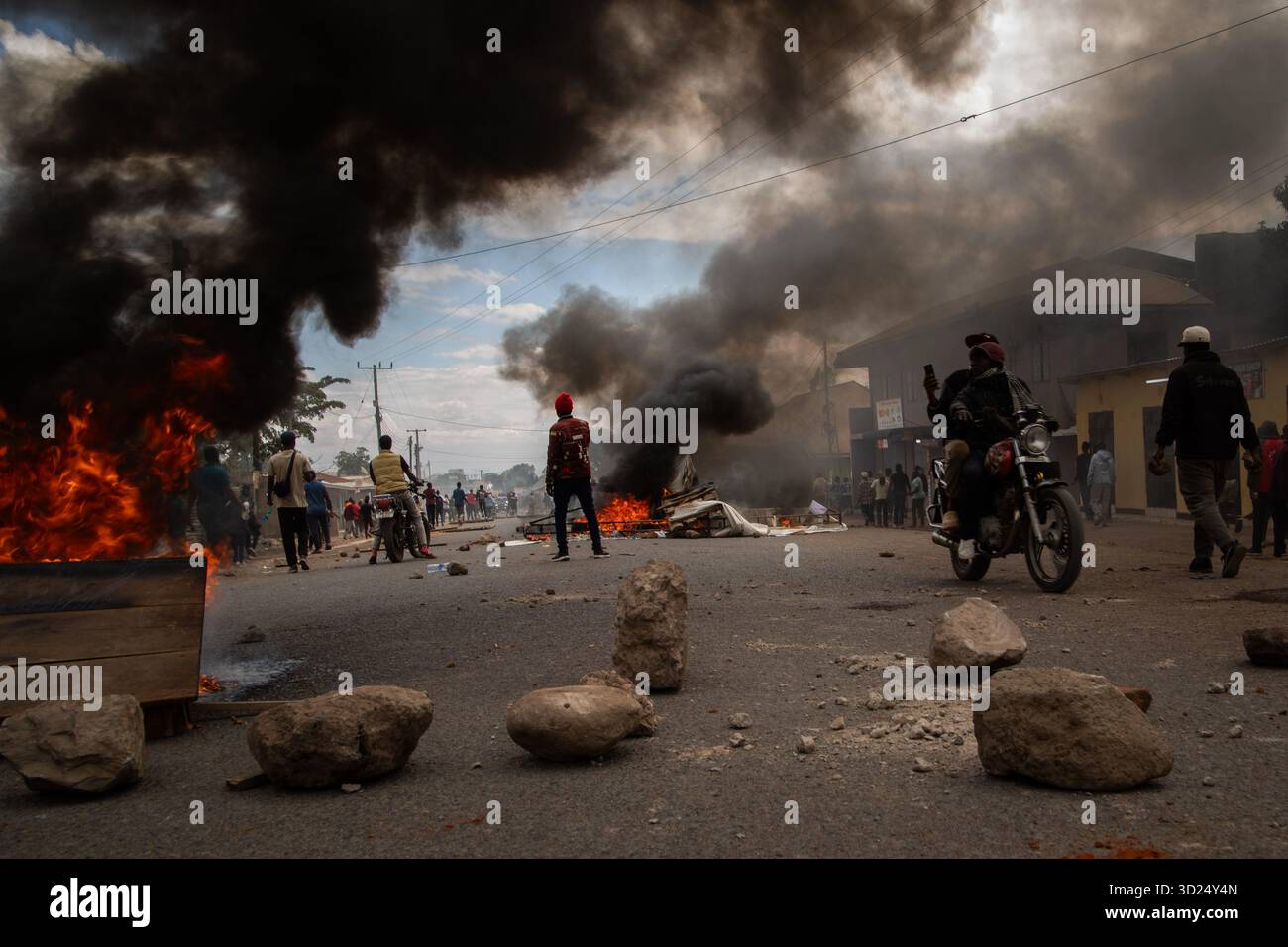 People protest in the streets of Arusha, Tanzania, on election day ...