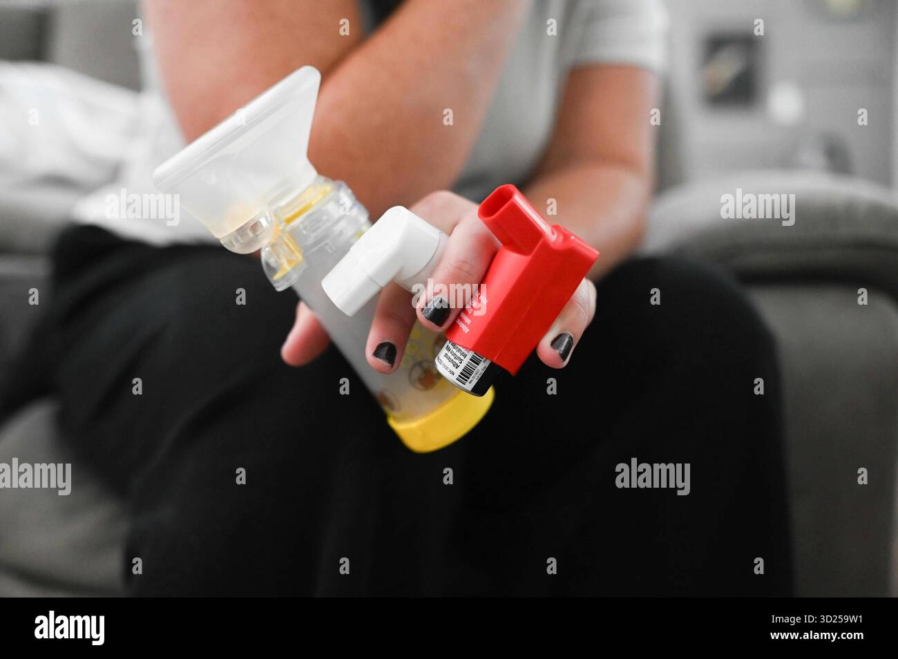 Jennifer Bittner holds her 6-year-old daughter Amelia's inhaler as she ...