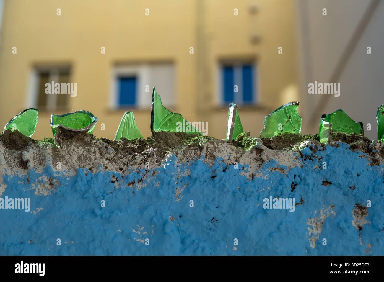 fence with broken glass protection from thieves Stock Photo - Alamy
