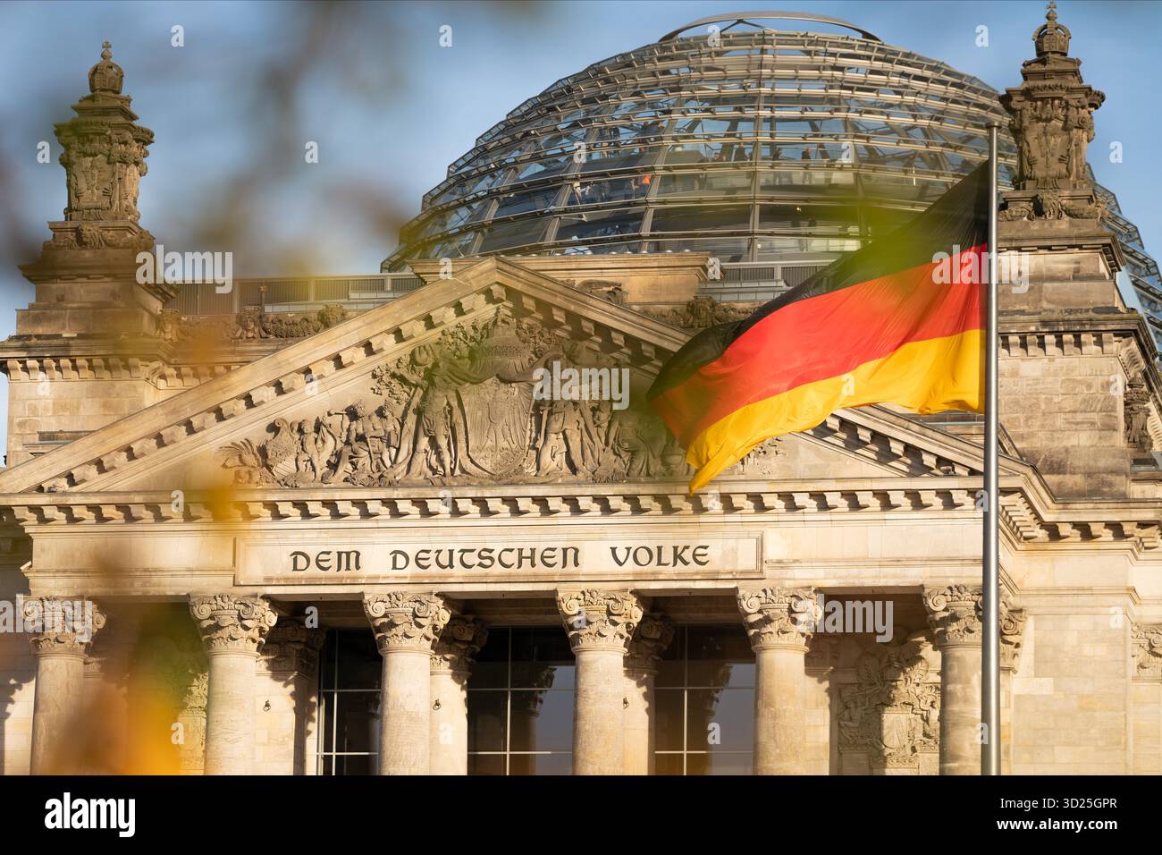 29 October 2025, Berlin: A German flag flies in front of the Reichstag ...