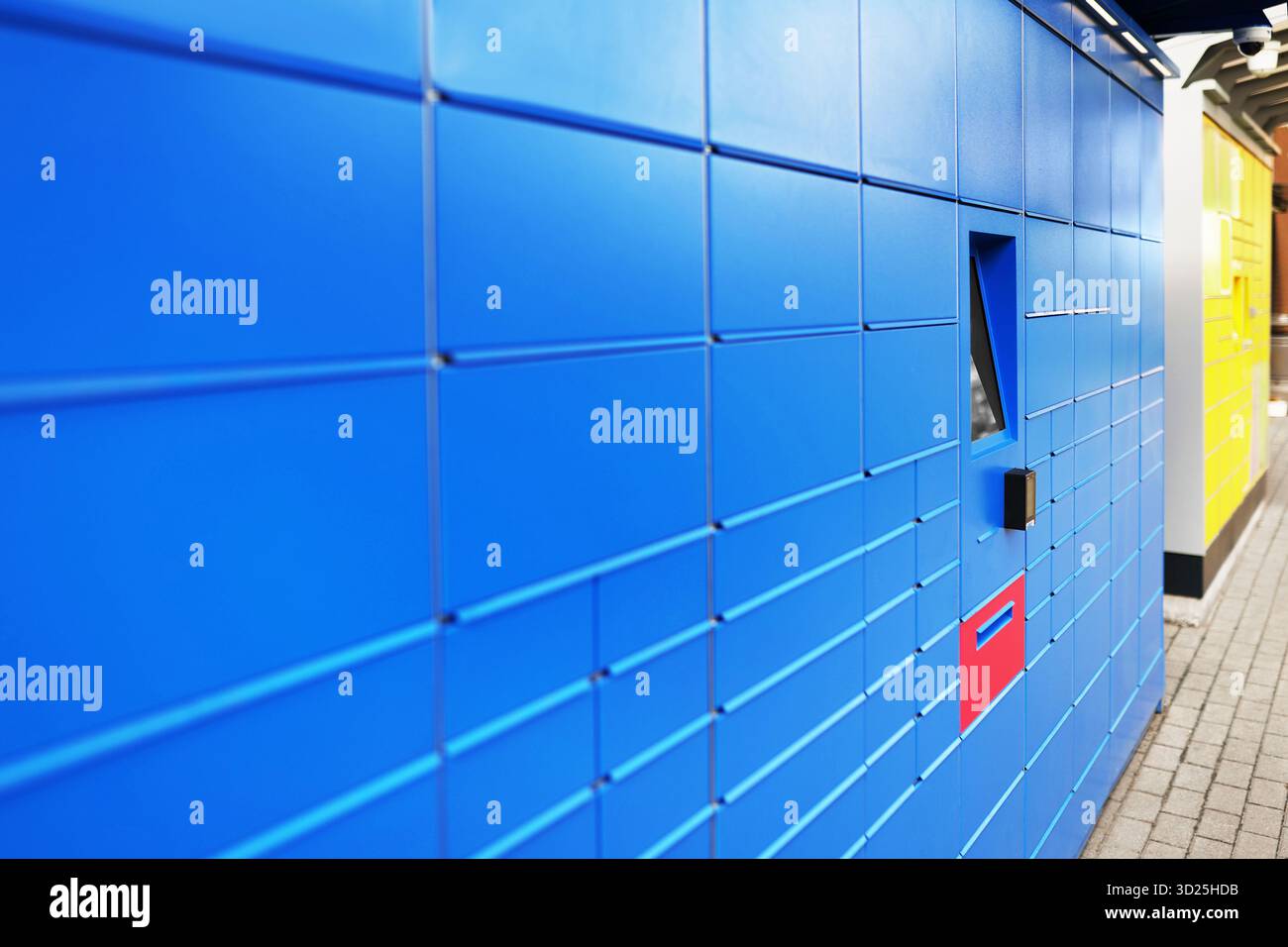 A blue parcel machine designed for receiving packages. The machine ...