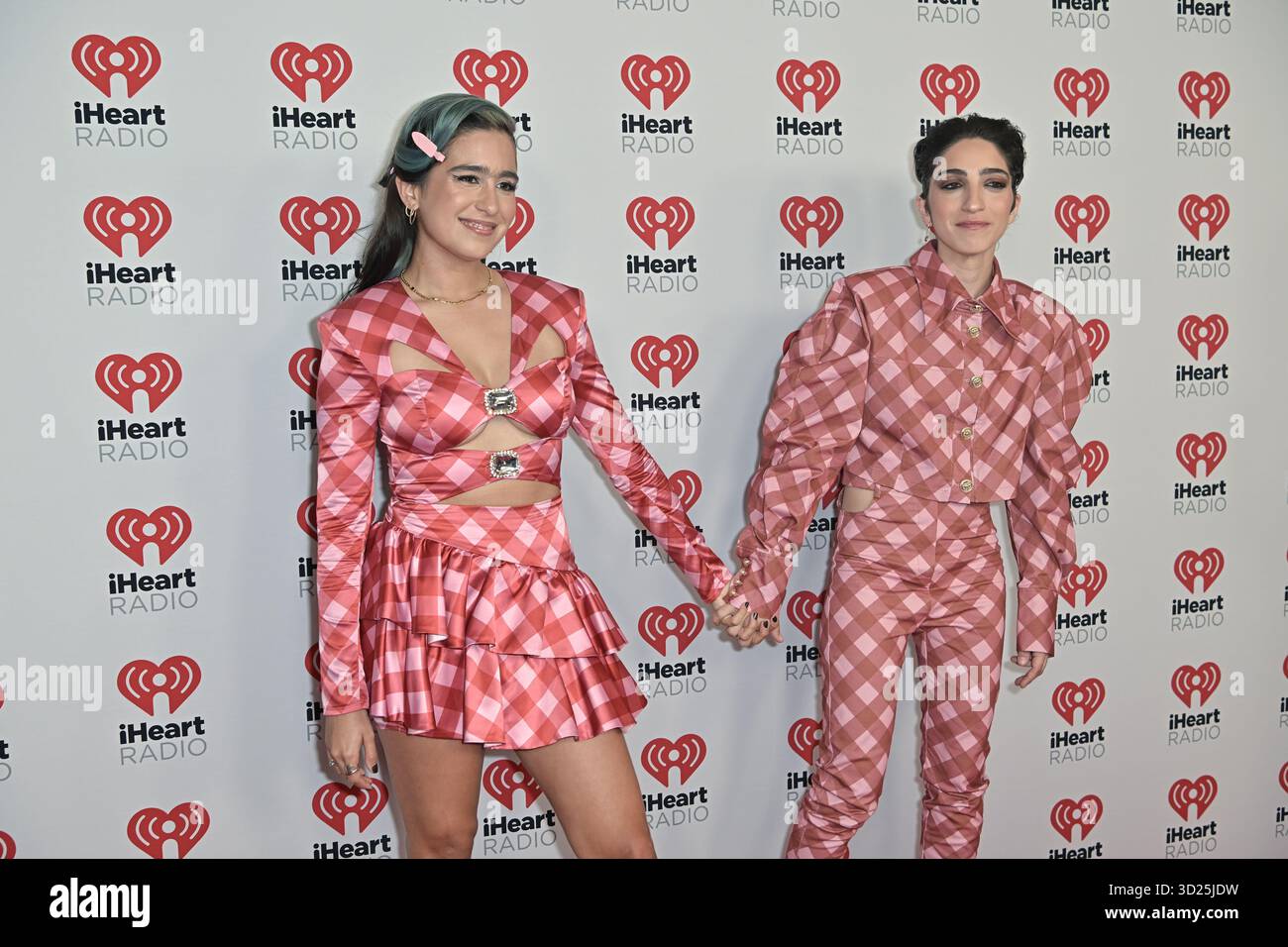 Gemeny Hernandez, left, and Emily Estefan, arrive to iHeartRadio Fiesta ...