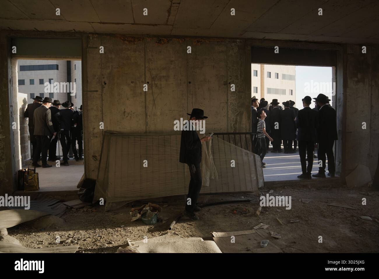 Ultra-Orthodox Jewish men attend a rally against plans to force them to ...