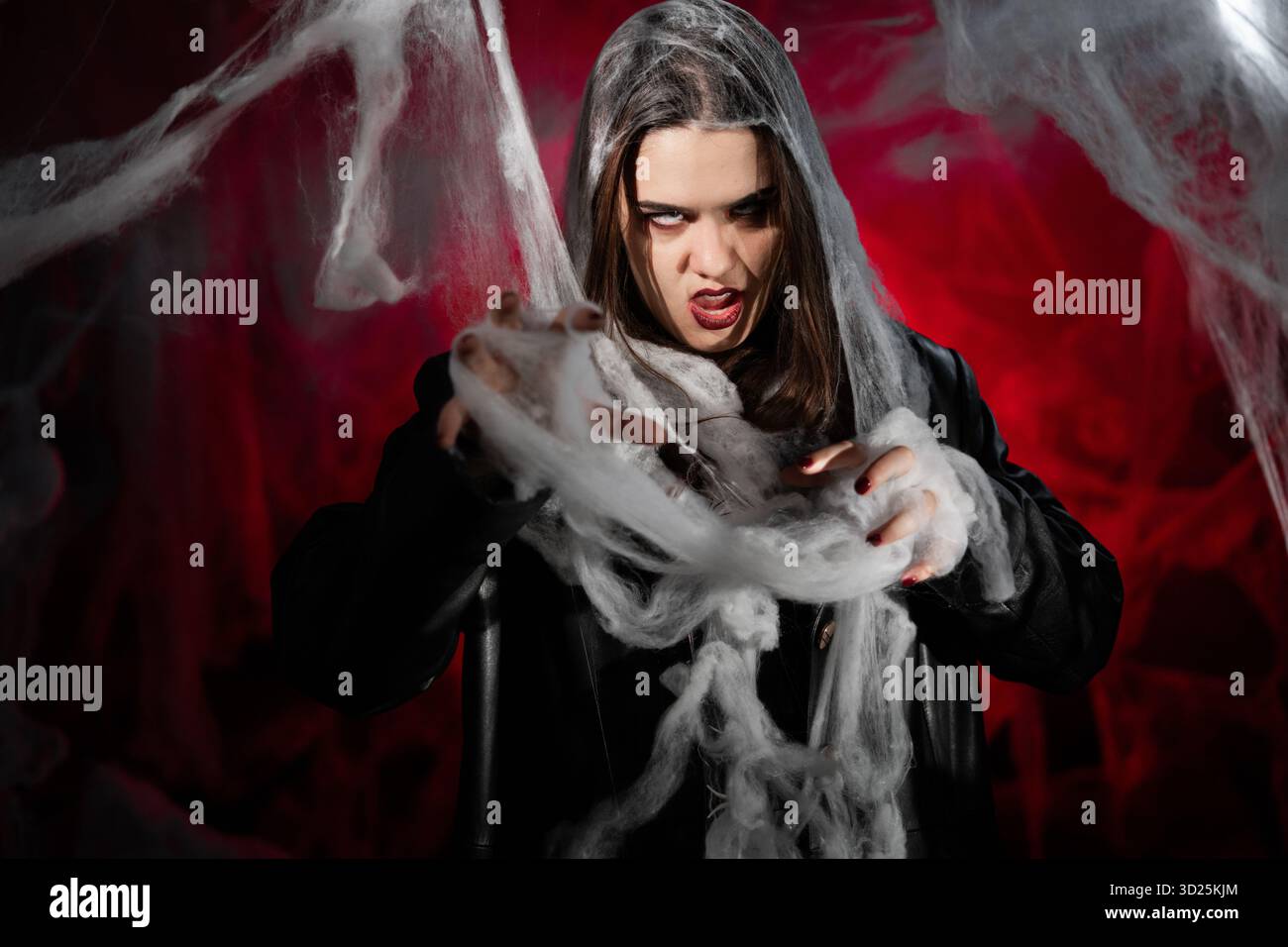 gothic woman with creepy vampire makeup trapped in spider web. Fantasy ...