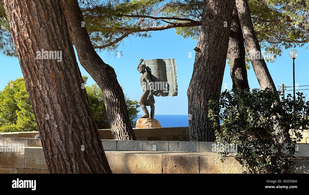 Heroic bronze statue of Spyros Kayales raising the Greek flag at ...