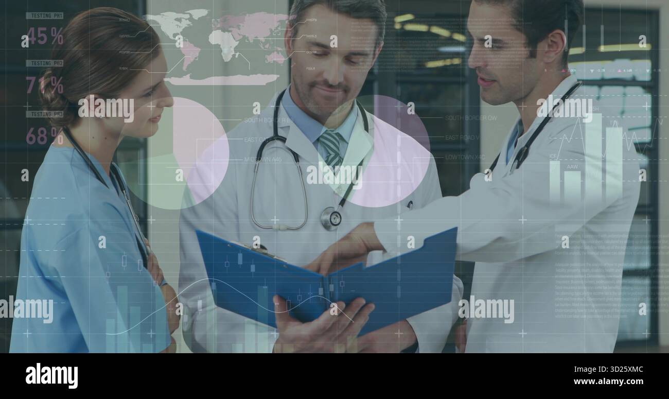 Collaborating medical staff reviewing patient records in hospital ...