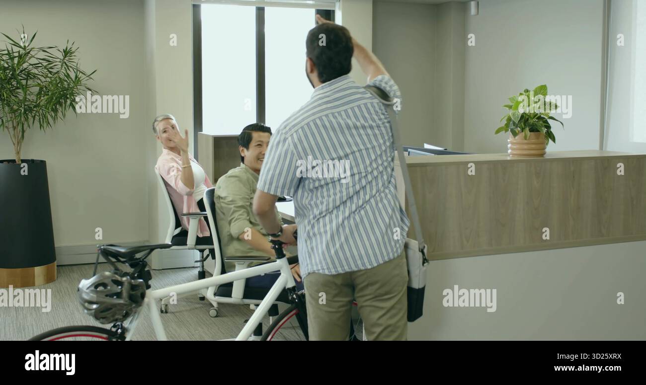 Standing man greeting reception staff at reception, with bicycle ...