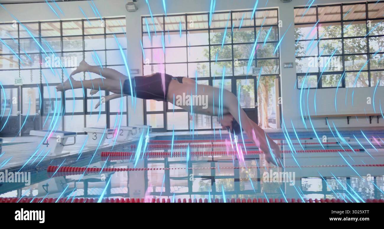 Diving athlete wearing trunks executing dive in pool, with starting ...