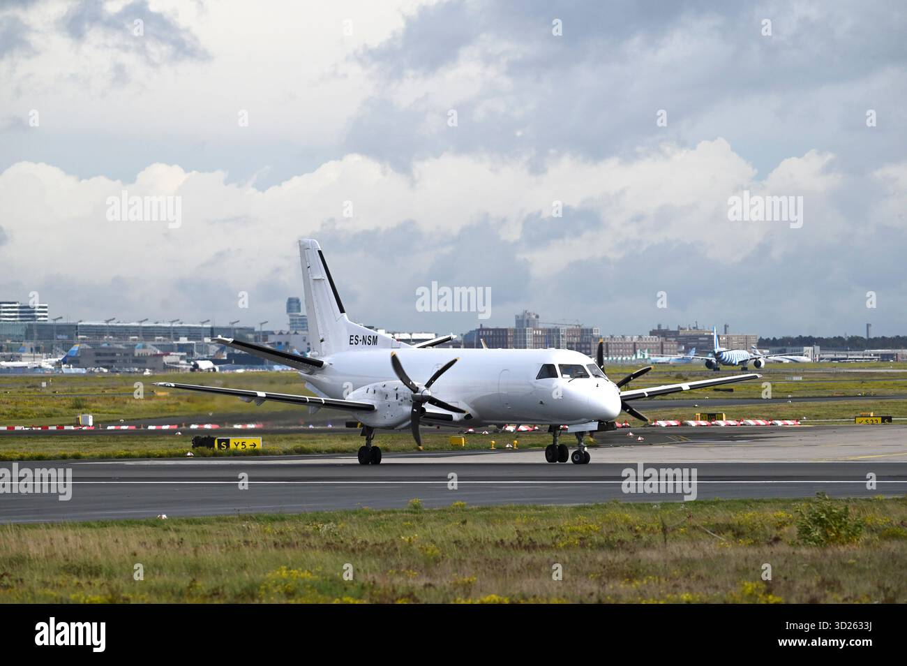 A NyxAir Saab 340 propeller plane before takeoff, runway west at ...