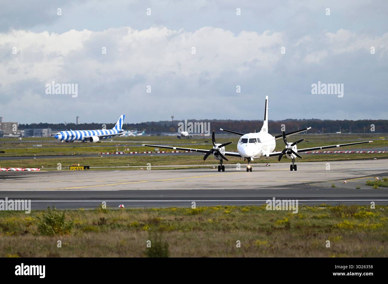 A NyxAir Saab 340 propeller plane before takeoff, runway west at ...