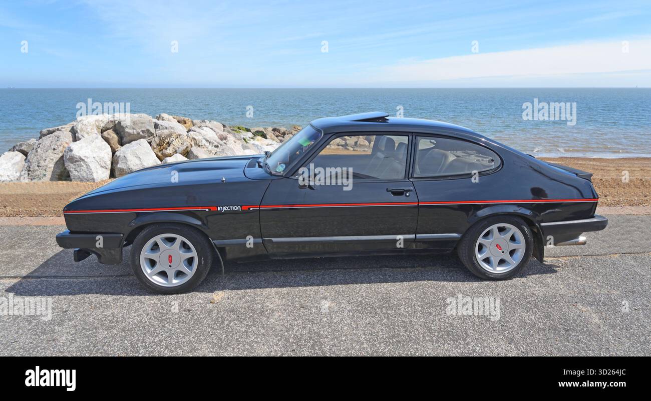 Classic Black Ford Capri Injection 2.8 parked on seafront promenade ...