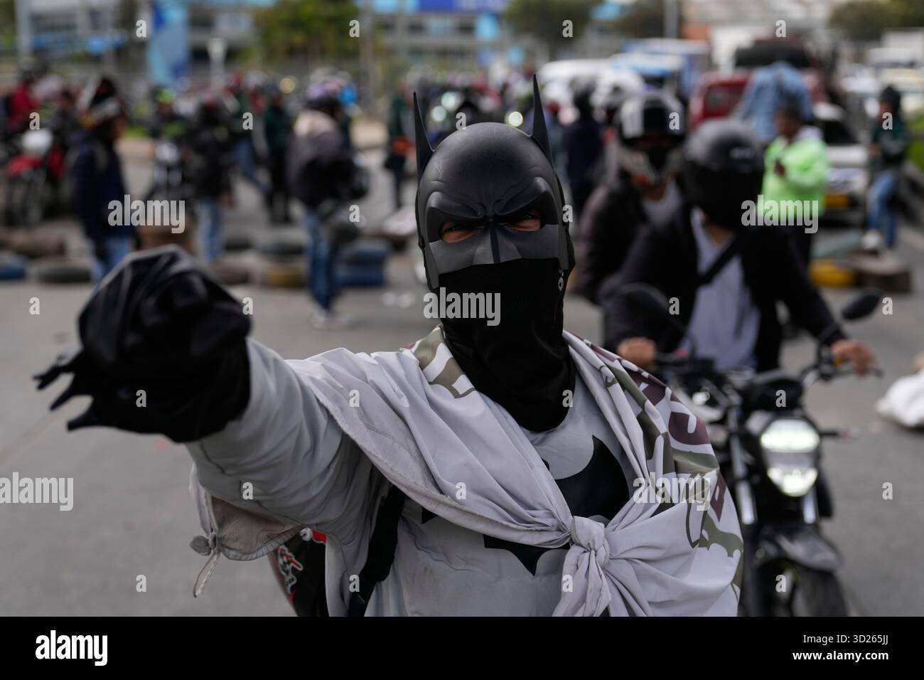 A motorcyclist dressed as Batman takes part in a protest against a ...