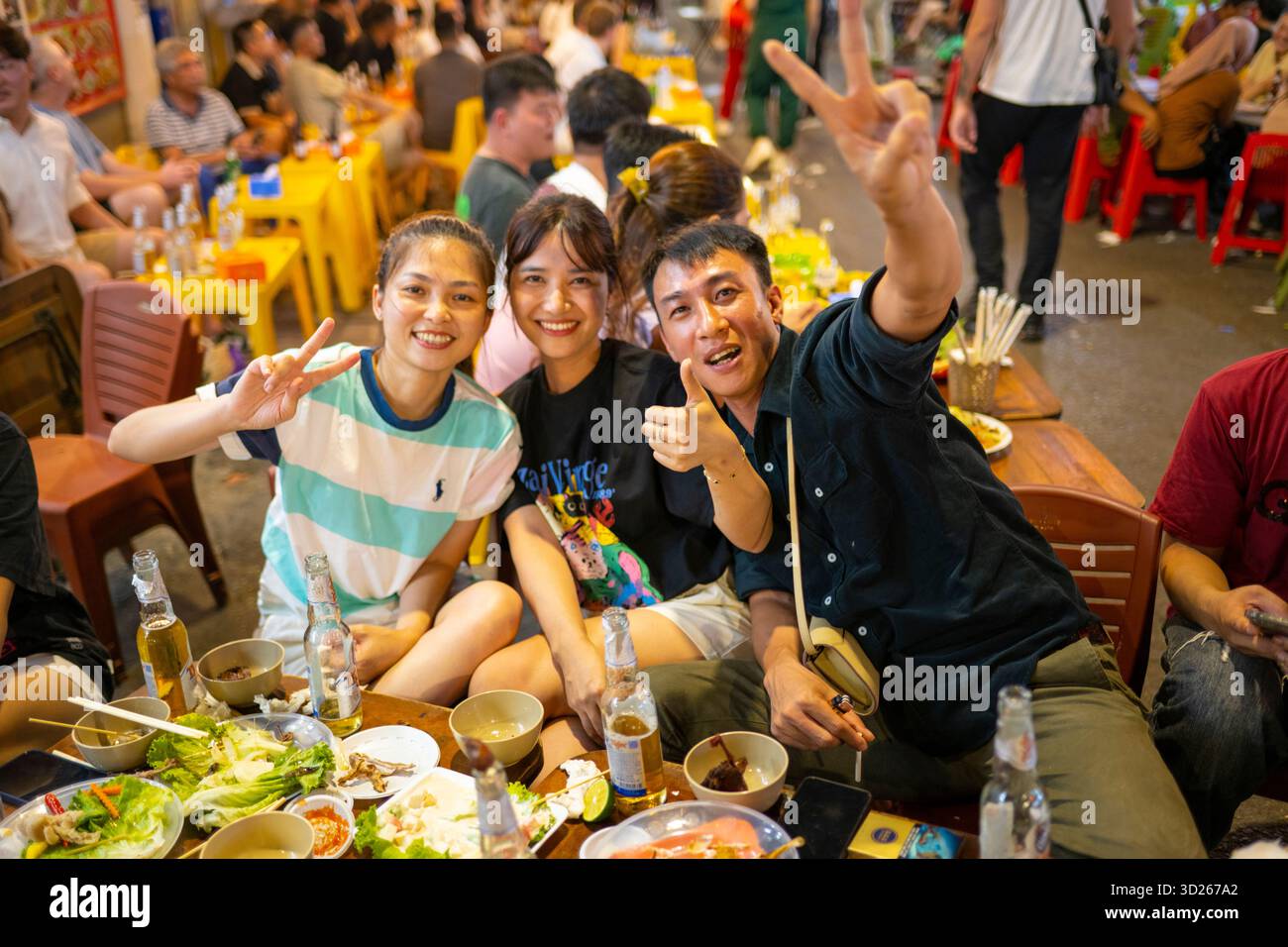 Hanoi,Vietnam-June 07 2025:Enjoying the night-life,crowds of friendly ...