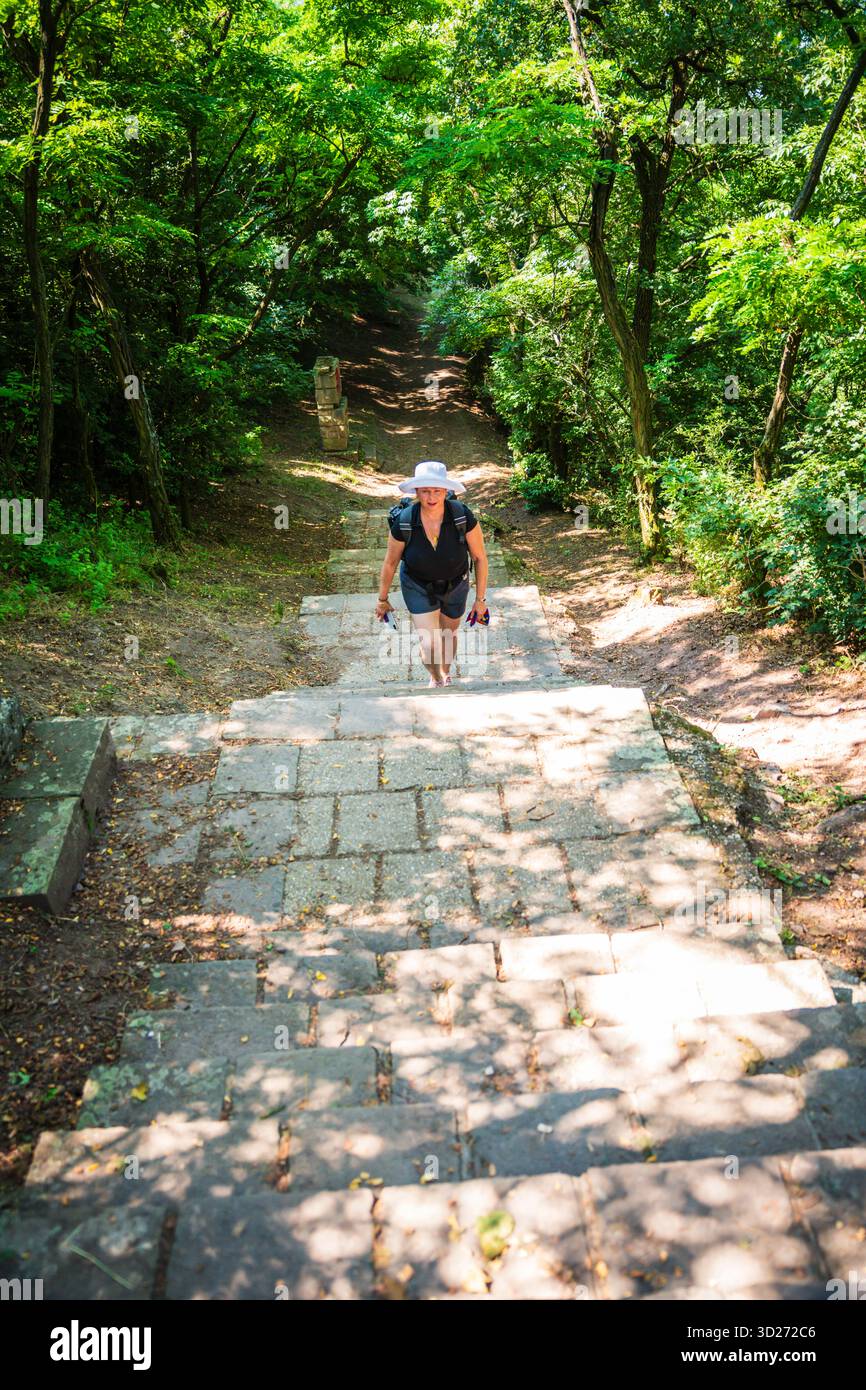 Visegrad, Hungary - June 25, 2019: Woman climbing steps on hiking ...