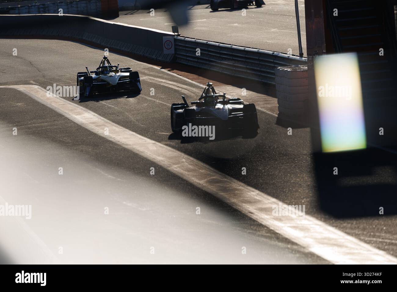 Valencia, Spain. 30th Oct 2025. Two Formula E cars driving down the pit ...