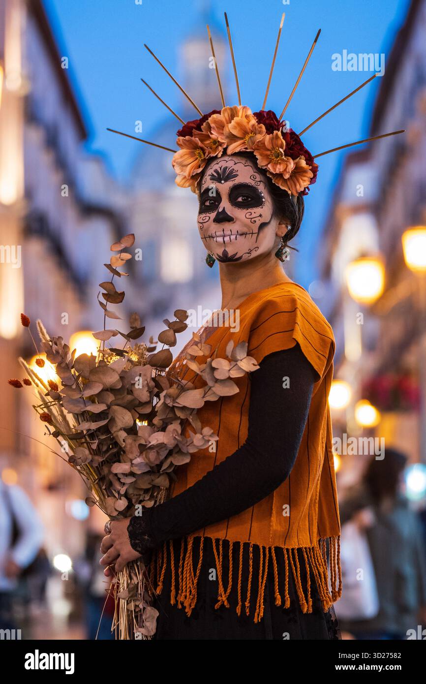 Portrait of a young Mexican woman dressed as a Catrina for the Day of ...