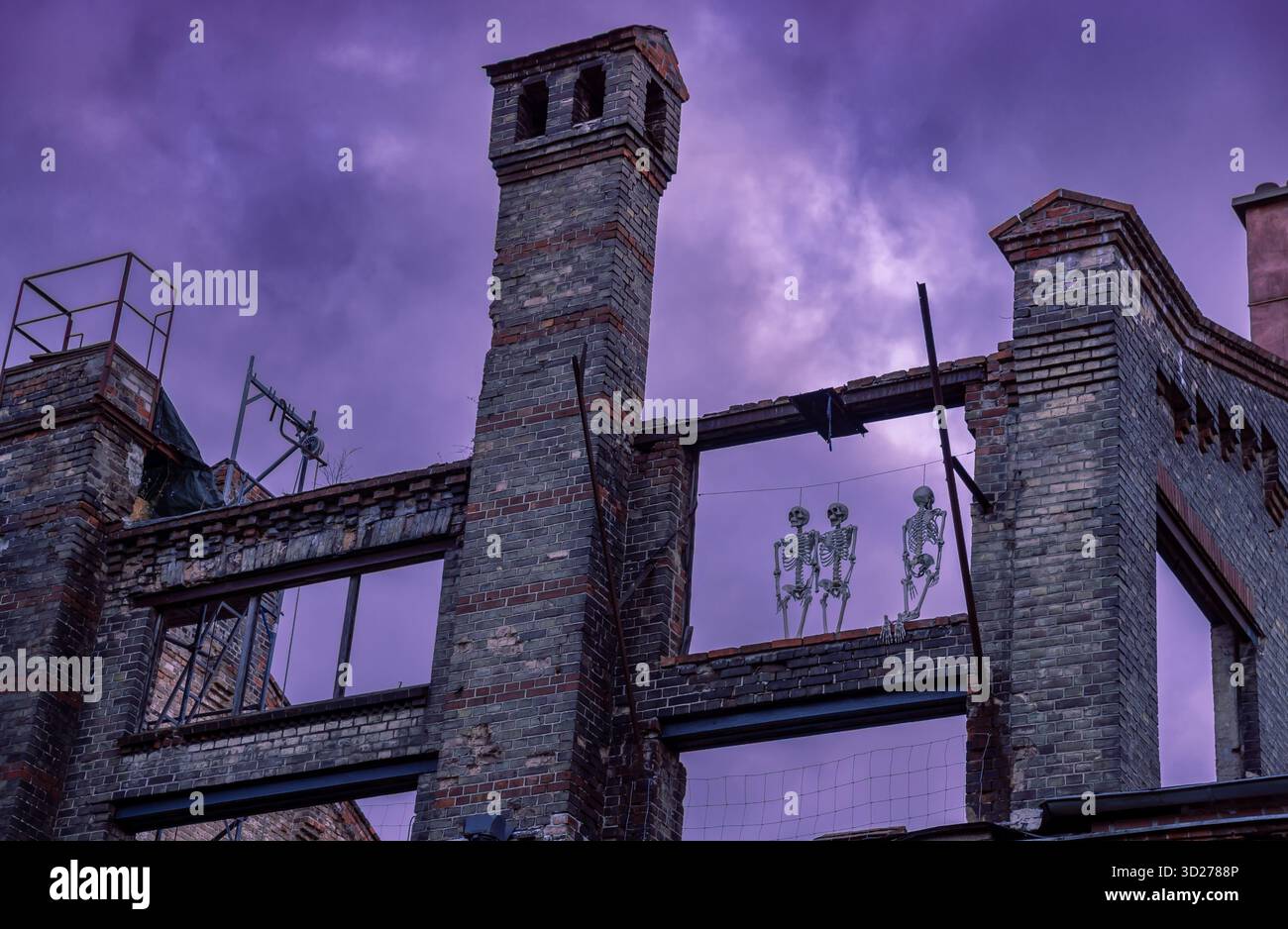 Close-up view of an abandoned brick structure with hanging halloween ...
