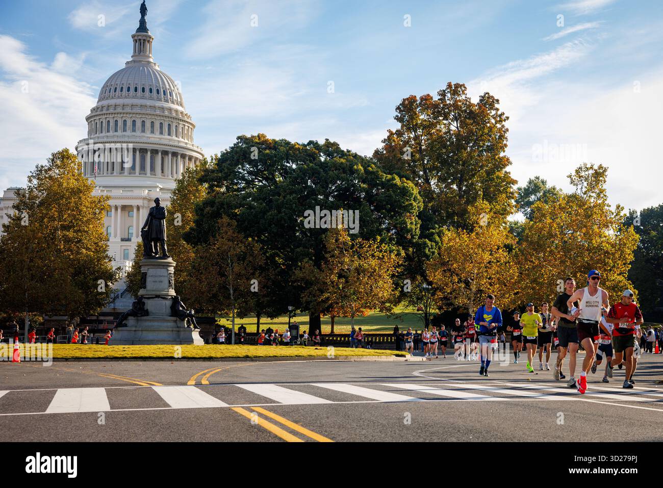 Participants of the 50th Marine Corps Marathon races through the course ...