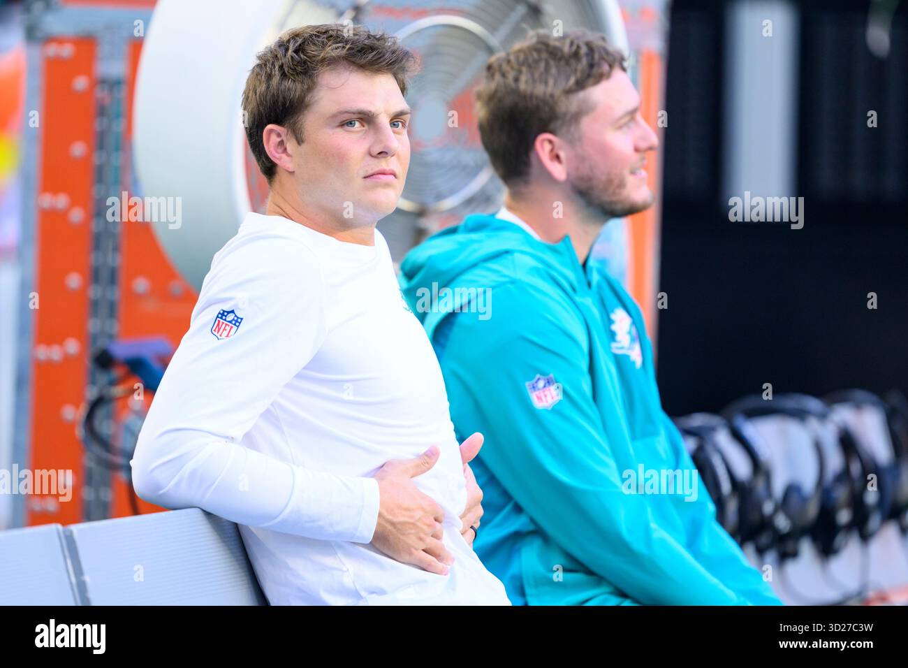 Miami Dolphins quarterback quarterback Zach Wilson sits on the bench ...