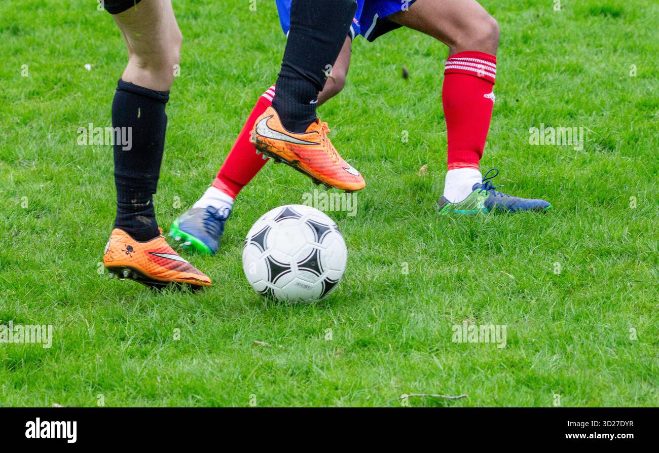 Blue defender shielding soccer ball hi-res stock photography and images ...