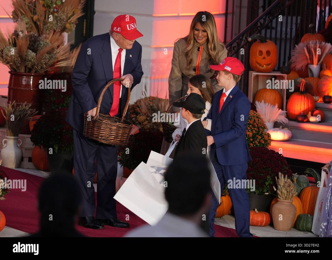 President Donald Trump, from left, and first lady Melania Trump hand ...