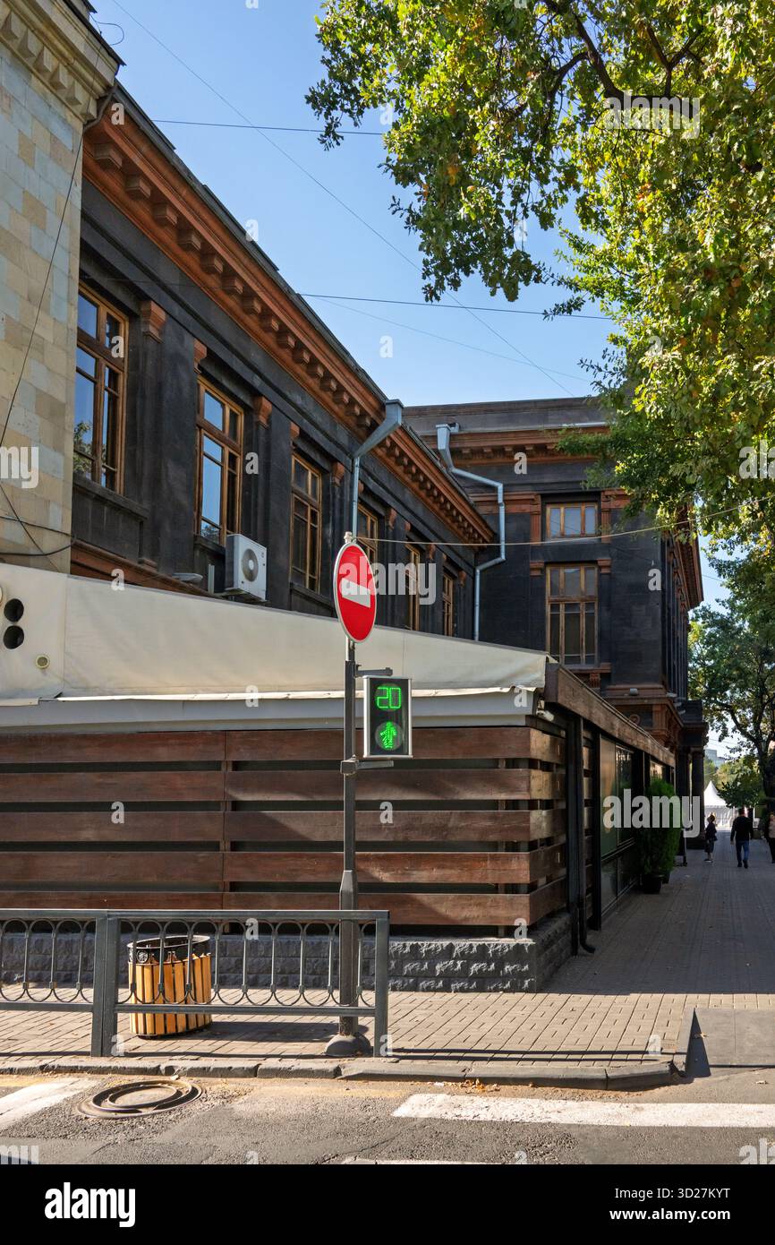 Yerevan, Armenia 10.16.2025. A street scene with a red and white stop ...
