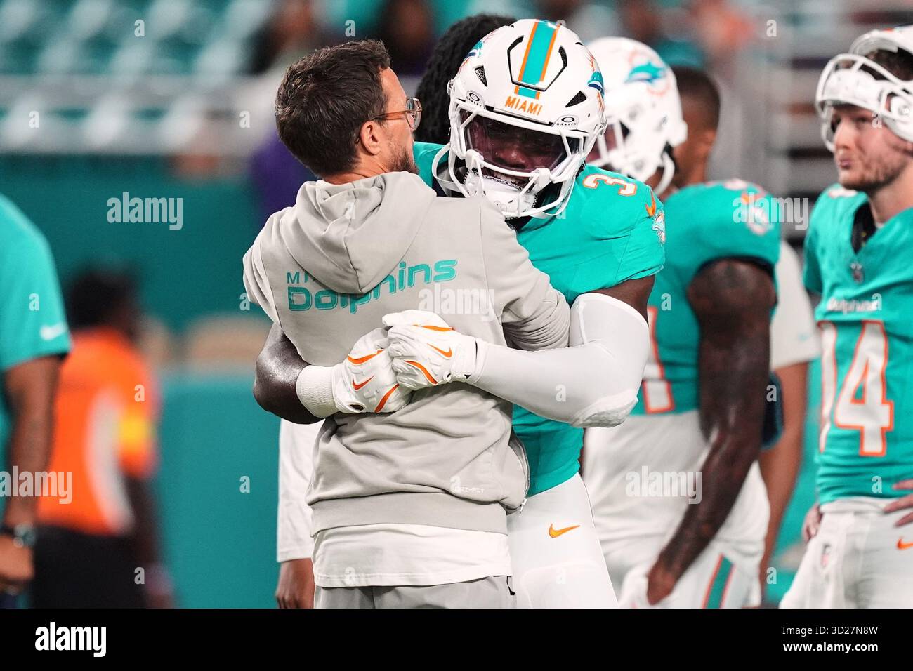 Miami Dolphins linebacker K.J. Britt (3) embraces head coach Mike ...