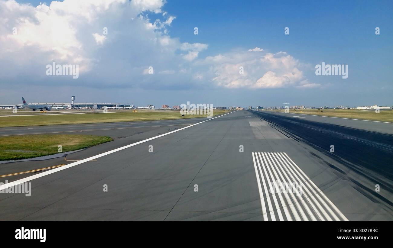 Toronto, ON, Canada - October 24, 2025: An empty airport runway with ...