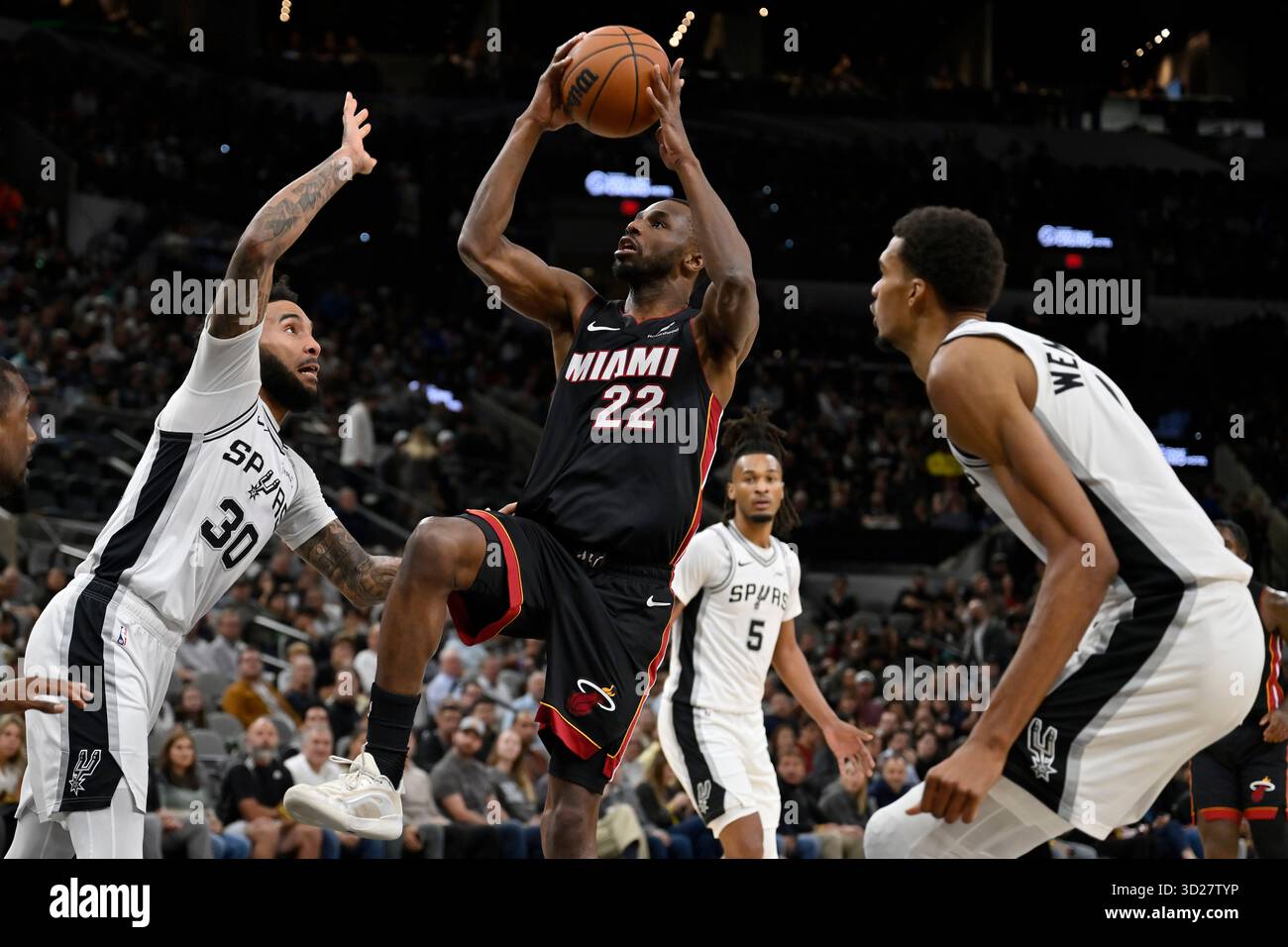Miami Heat forward Andrew Wiggins (22) goes to the basket against San ...