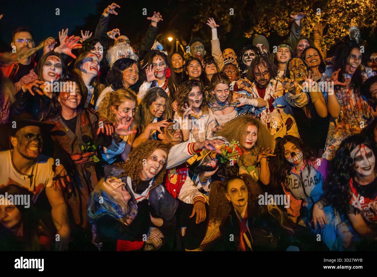 People dressed as zombies pose during a flash mob at El Retiro Park in ...