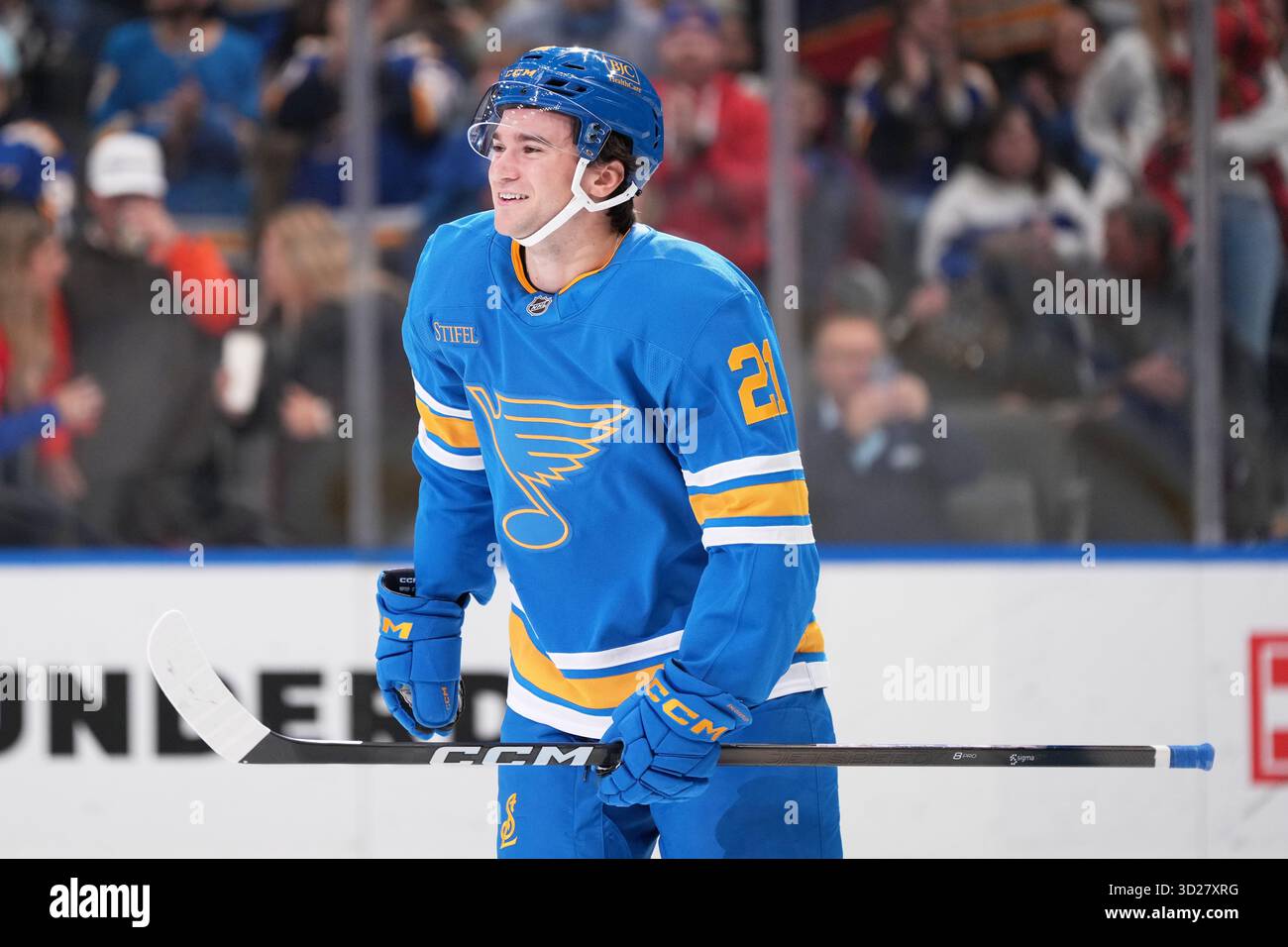 St. Louis Blues' Jimmy Snuggerud (21) smiles after scoring during the ...